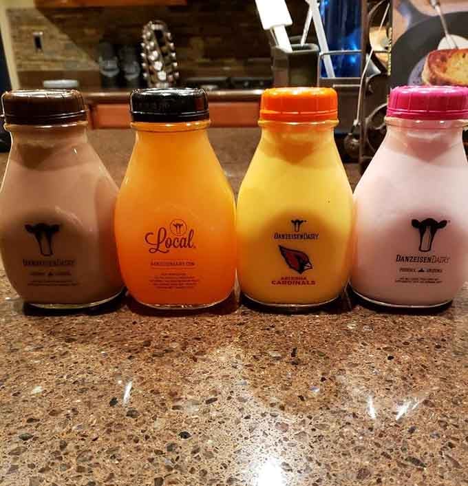 Fresh dairy in classic bottles lined up like a rainbow of wholesome goodness straight from the source.