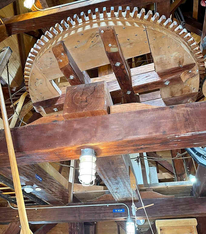 These wooden gears are the heart of the operation, turning wind into power the old-fashioned way.
