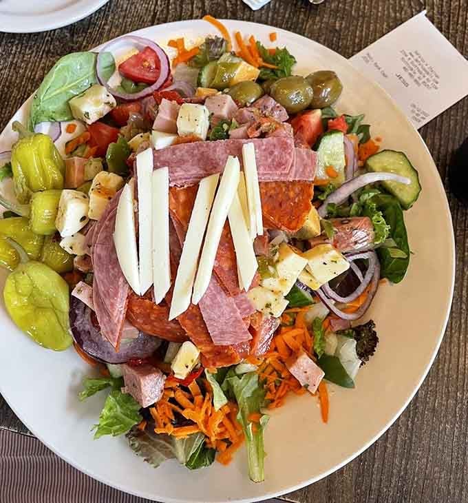 This antipasto salad is basically an Italian charcuterie board that someone brilliantly decided to put on greens.