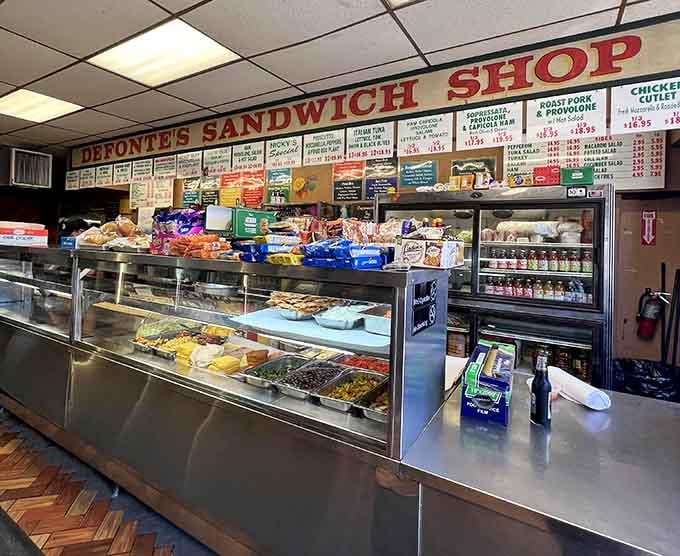 That long deli counter is where the magic happens, stacked with ingredients and decades of sandwich-making wisdom.