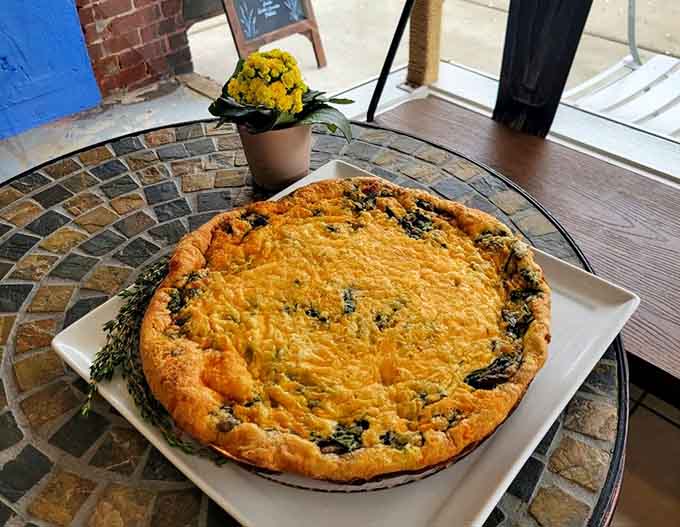 That golden frittata sits proudly on mosaic tiles, looking like Sunday brunch done absolutely right.