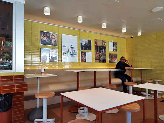 That yellow wall isn't just decor, it's the backdrop to countless satisfied customers enjoying their favorite chicken dishes.