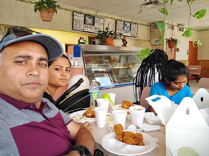 Real families enjoying real food together, proving that the best restaurants are where people actually want to spend time eating.