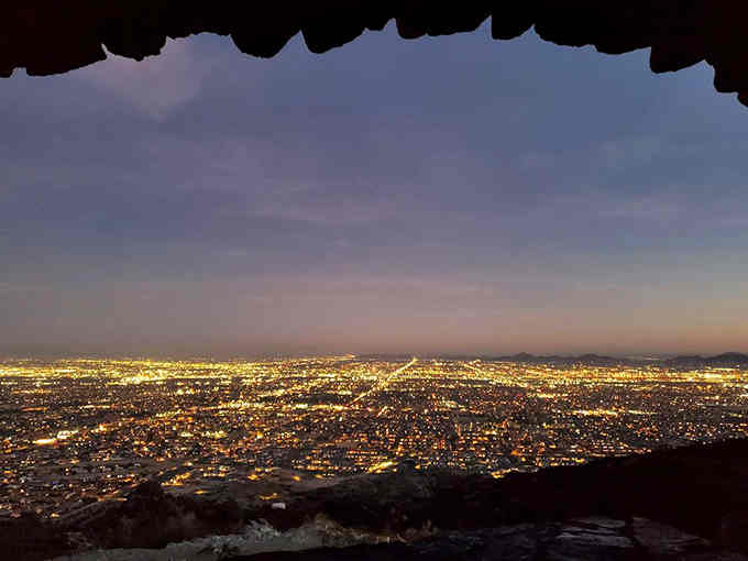 When darkness falls, the valley transforms into a glittering carpet of lights that stretches endlessly toward every horizon.