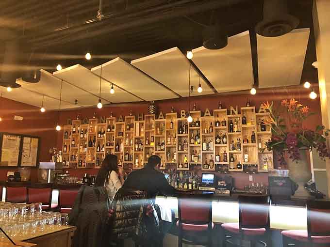 The bar's wall creates a nostalgic backdrop perfect for sipping rum and contemplating life's pleasures.