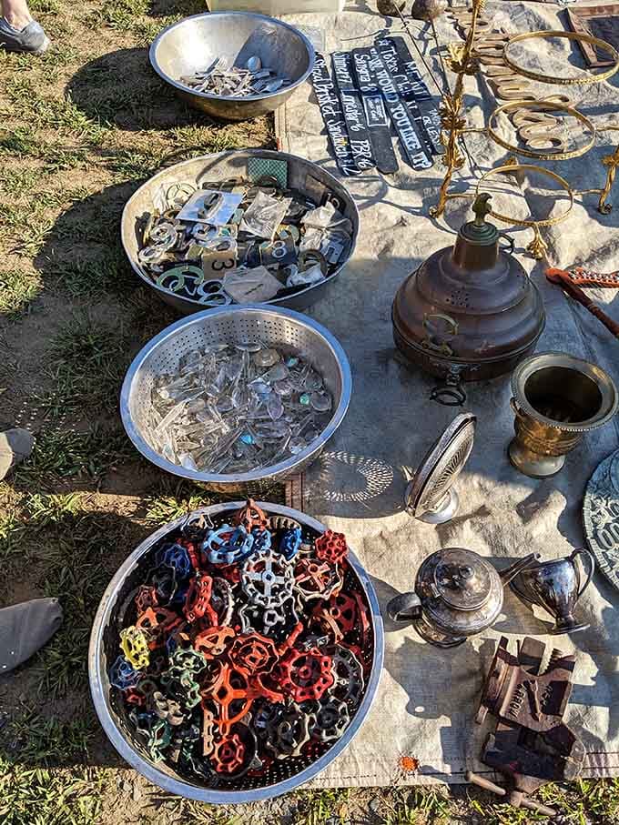 Bowls of colorful vintage faucet handles and mysterious metal objects await someone who knows their true purpose.