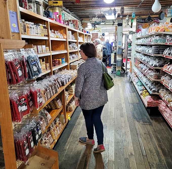 Shoppers navigate narrow aisles discovering unexpected treasures, proving browsing beats scrolling every single time.