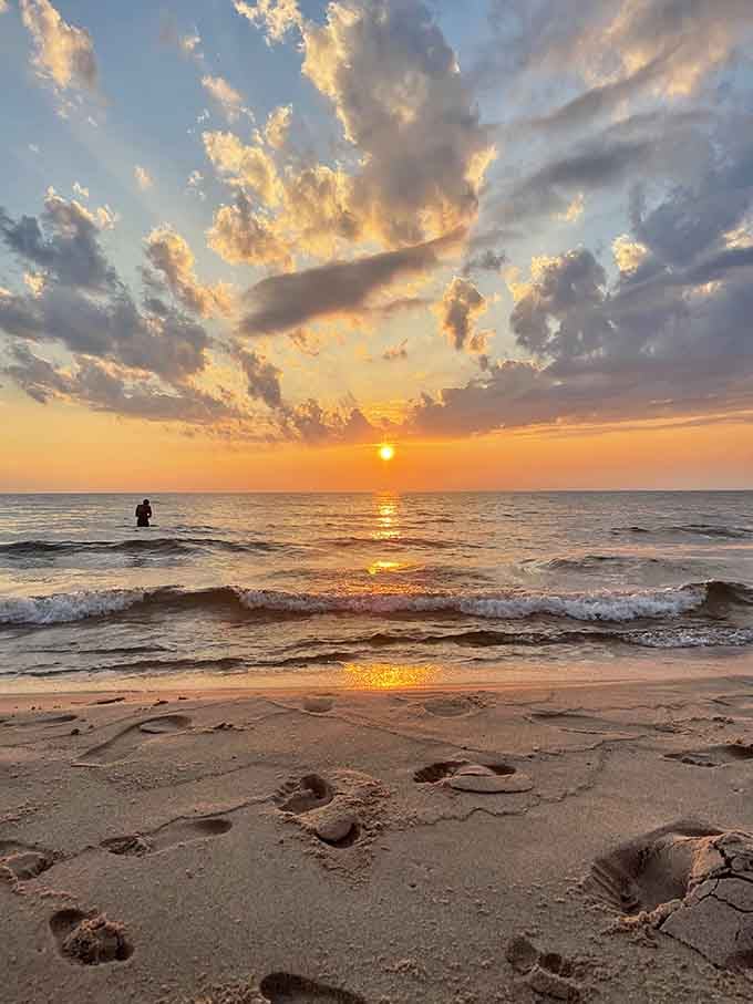 Golden hour transforms the beach into a masterpiece worthy of hanging in a gallery, footprints adding character to perfection.