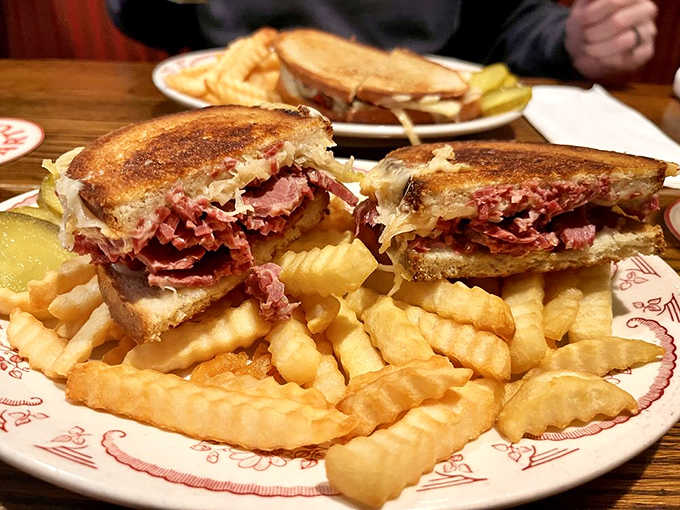 A properly constructed Reuben with corned beef, Swiss, sauerkraut, and Russian dressing on authentic rye bread.