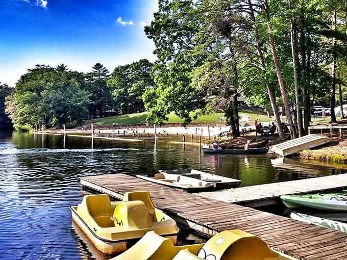 Yellow paddleboats waiting patiently at the dock like eager golden retrievers ready for their next lake adventure together.