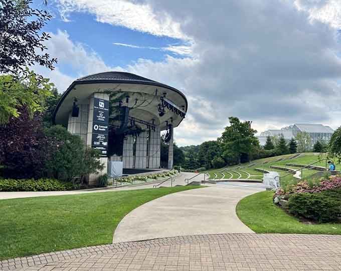 The amphitheater sits nestled into rolling hills like nature's own concert venue, minus the overpriced parking hassles.