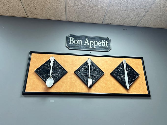 Even the wall art knows good food deserves proper appreciation and a cheerful French blessing.