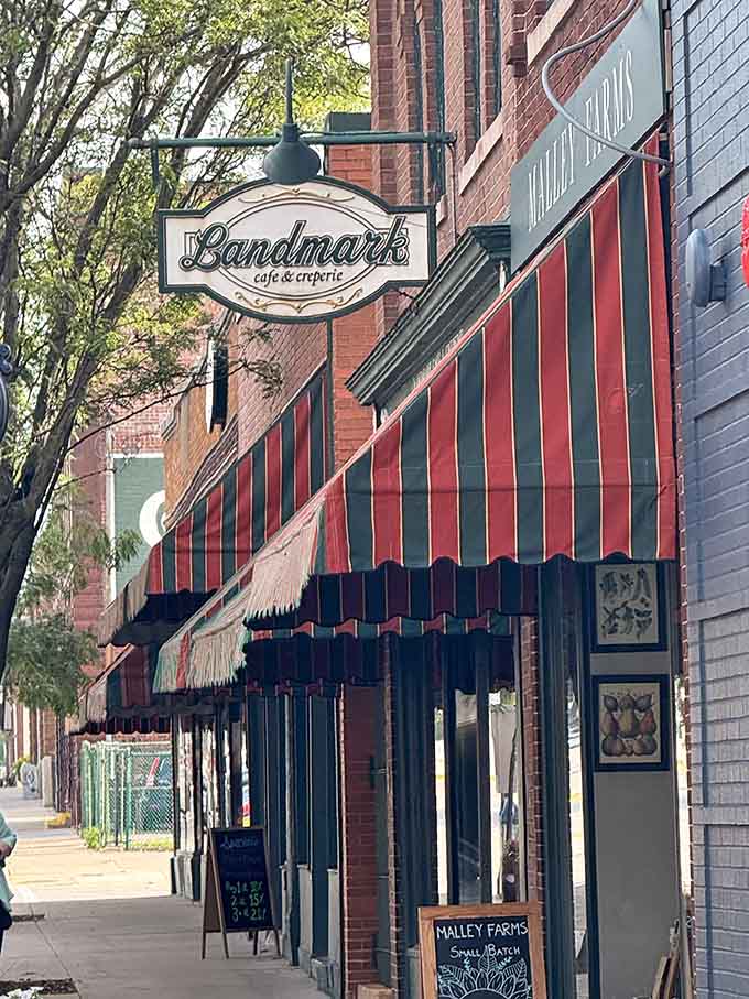 That classic striped awning and vintage signage prove downtown charm isn't dead, just patiently waiting to be rediscovered.