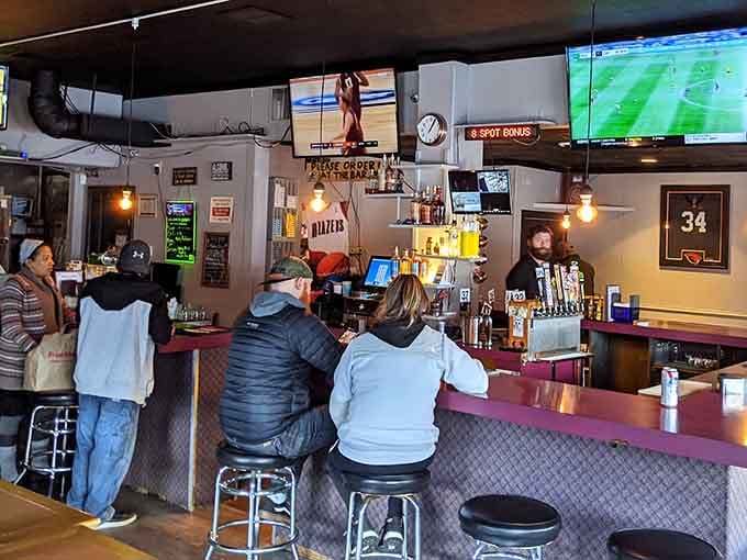 Locals bellied up to the bar watching the game: this is neighborhood tavern culture at its finest.