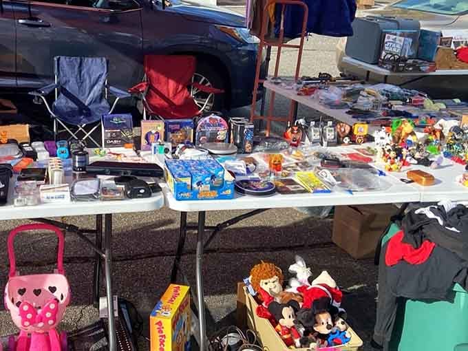 Tables overflow with random treasures from action figures to electronics, creating a beautiful mess of potential discoveries everywhere.