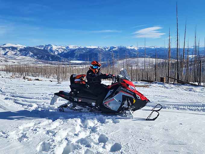 Snowmobiling here means trading your car horn for an engine roar and your traffic jam for pure mountain freedom.