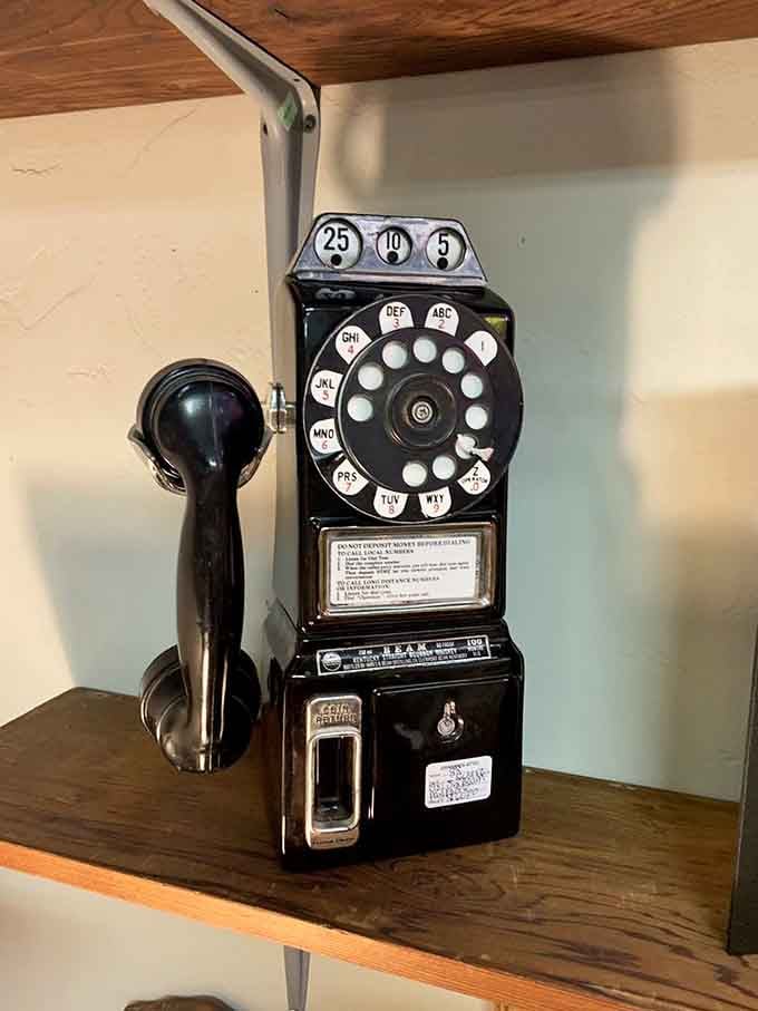 This rotary payphone remembers when calling someone actually required quarters, patience, and genuine commitment to conversation.