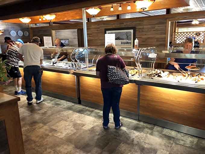 Modern buffet stations with protective shields prove you can maintain old-fashioned hospitality while embracing contemporary food safety standards.