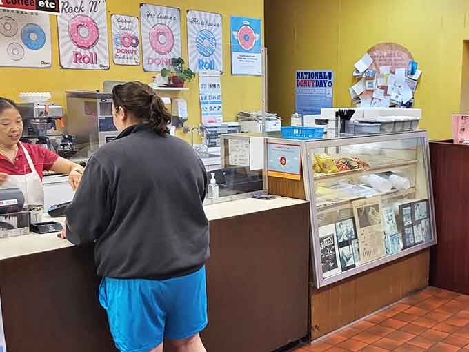 The counter where dreams come true and decisions get made about which donuts deserve to come home with you.