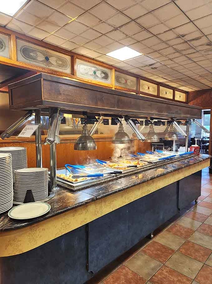 Heat lamps keep everything fresh while stacks of plates stand ready for your culinary exploration journey.
