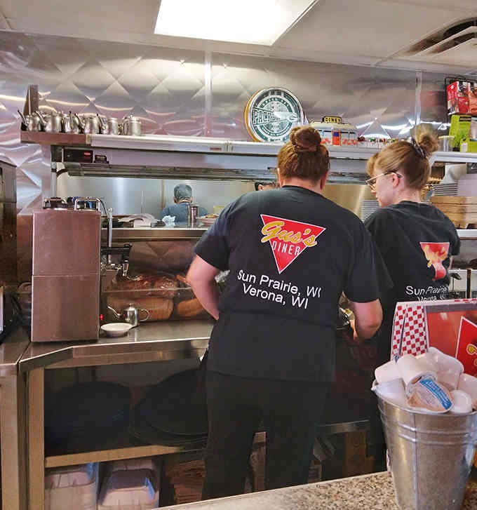 The kitchen crew wearing Gus's gear, making magic happen one perfectly cooked egg at a time.