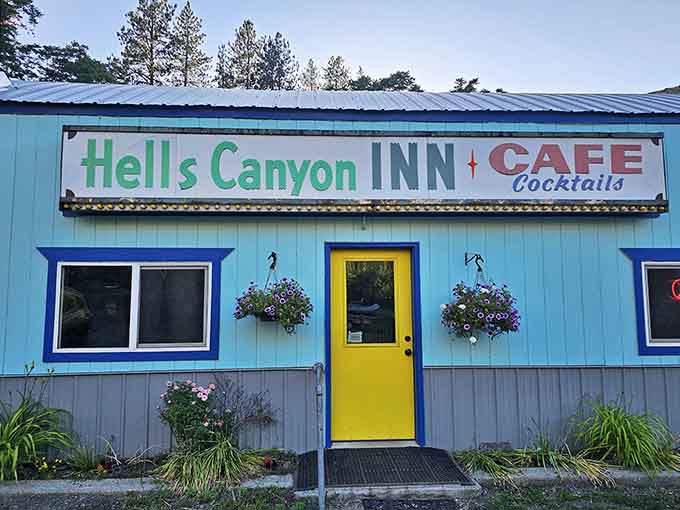 Hell's Canyon Inn greets visitors with cheerful colors and hanging flowers, promising comfort after long scenic drives.
