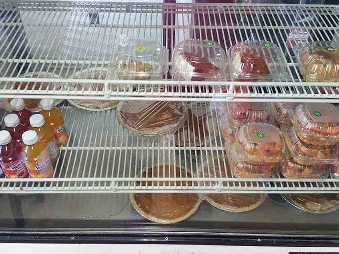 A refrigerator case filled with desserts and drinks is basically a preview of the happiness awaiting your future self.