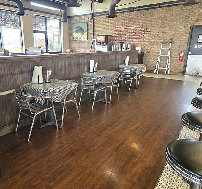 Metal chairs, exposed ductwork, and enough seating to bring the whole crew for lunch.