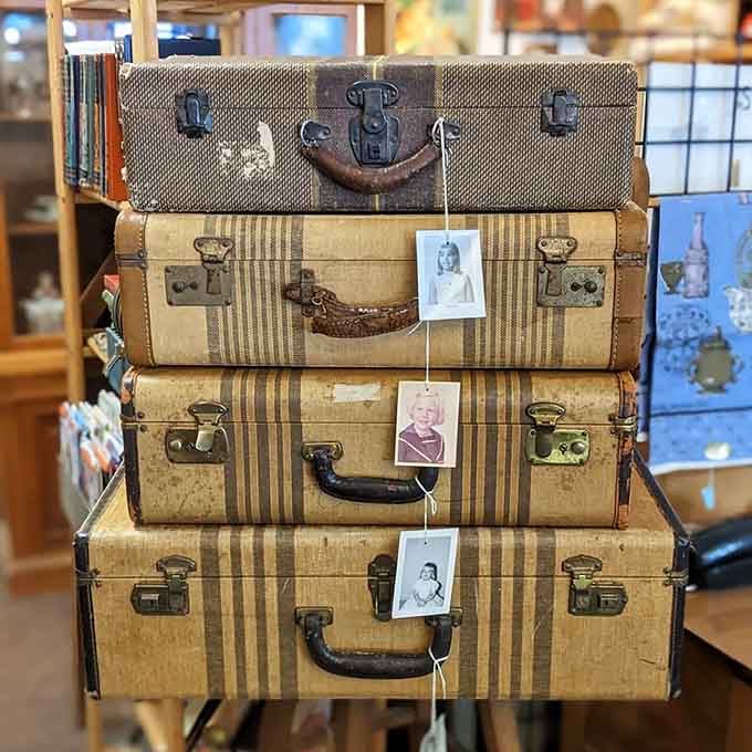 Vintage suitcases stacked like they're planning one last grand adventure together.