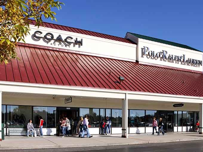 Coach and Polo Ralph Lauren side by side, because apparently even outlet stores believe in keeping classy company together.