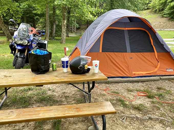 Modern camping meets Old West charm, because sometimes you need both a motorcycle and a picnic table in life.