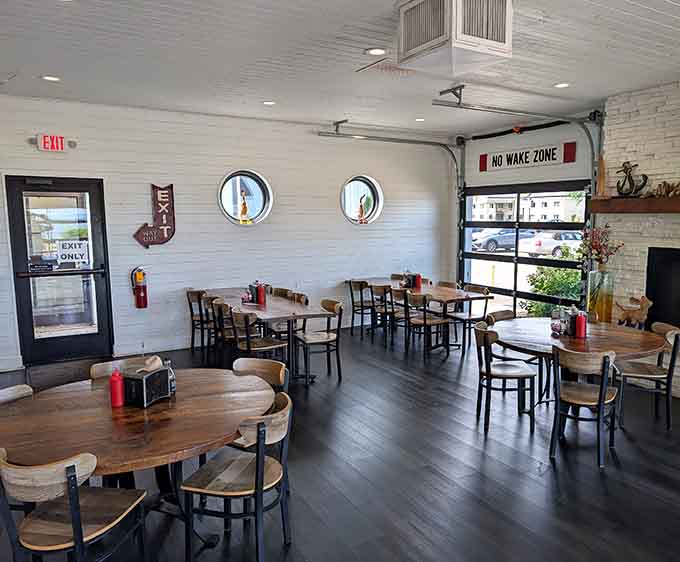 Round porthole windows and nautical touches create an atmosphere that's shipshape without being over the top about it.