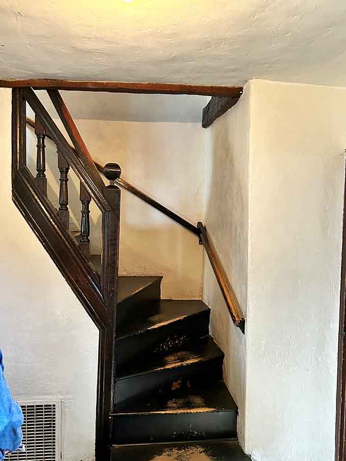 These narrow stairs creak ominously with every step, adding authentic atmosphere whether you want it or not.