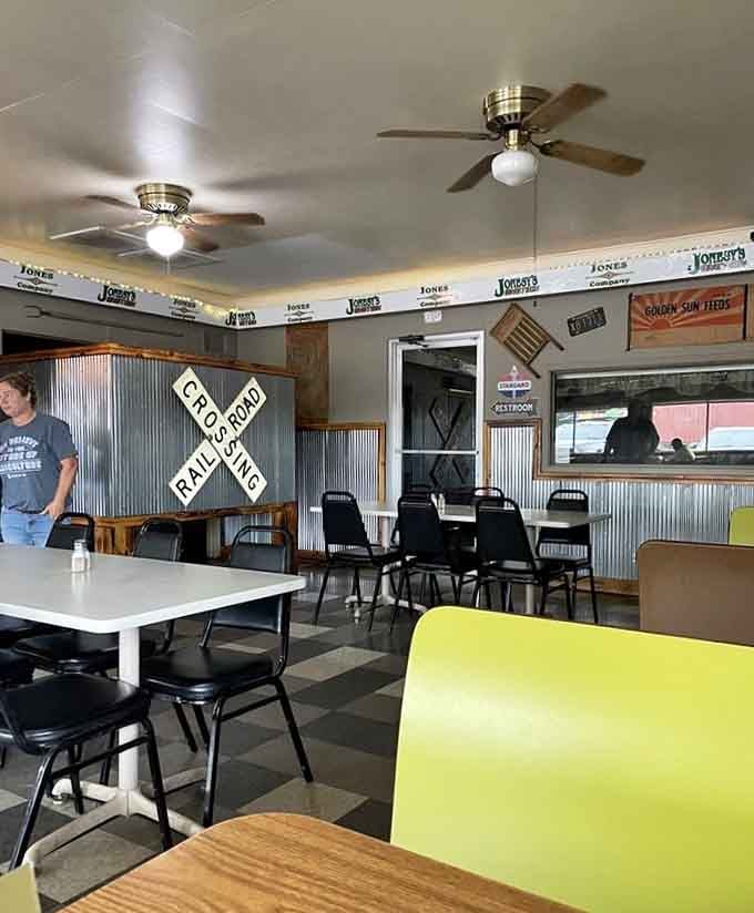 Railroad crossing signs and corrugated metal walls create that authentic small-town diner vibe you just can't manufacture or fake.