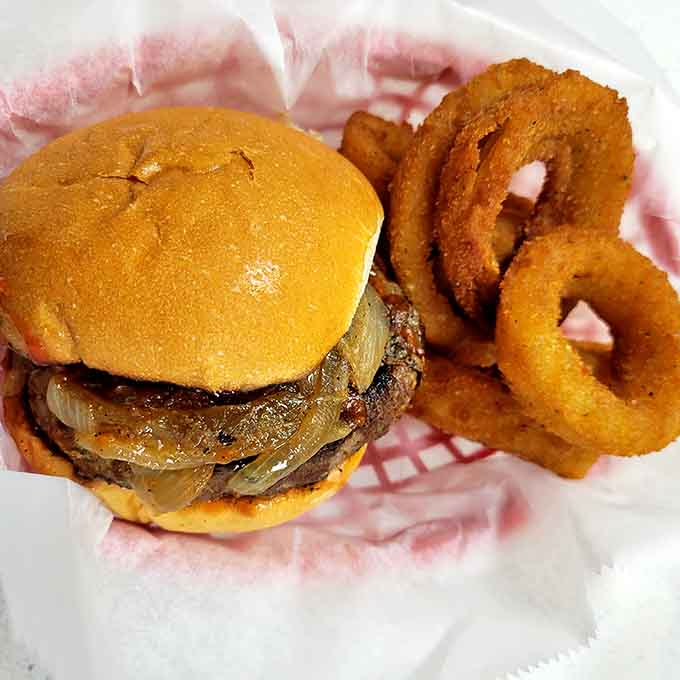 That burger and those onion rings are basically a marriage made in deep-fried heaven with cheese officiating.