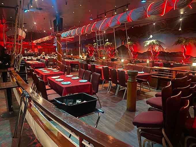 The boat-themed dining area features a suspended vessel overhead because subtlety was never part of the plan here.