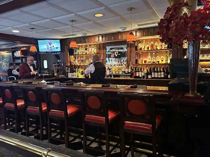 The bar beckons with top-shelf spirits and the promise of a perfectly mixed drink before your feast.