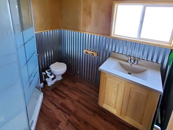 Compact bathroom proving you don't need a spa to feel refreshed when surrounded by this much water.