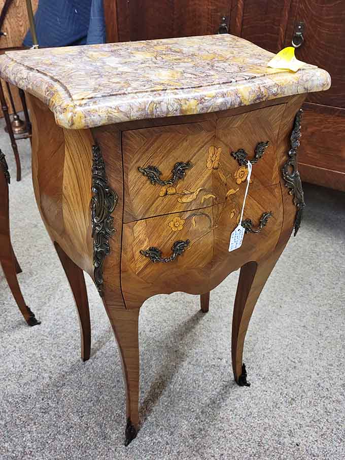 French-inspired curves and marble top make this bedside table fancier than most people's entire bedroom furniture collections today.