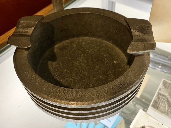 A Hindenburg ashtray that survived the disaster, because apparently even tragedy couldn't stop people from needing a smoke back then.