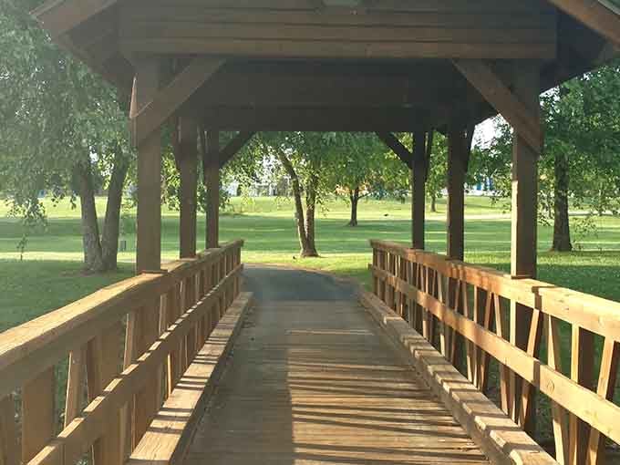 The covered bridge invites leisurely strolls where the biggest decision is whether to walk fast or really, really slow.