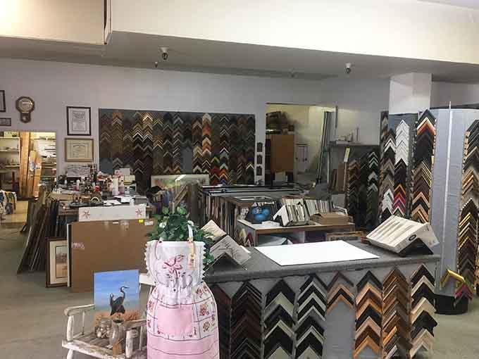 Art By Design's frame shop interior shows local businesses still thrive on craftsmanship over corporate cookie-cutter operations.