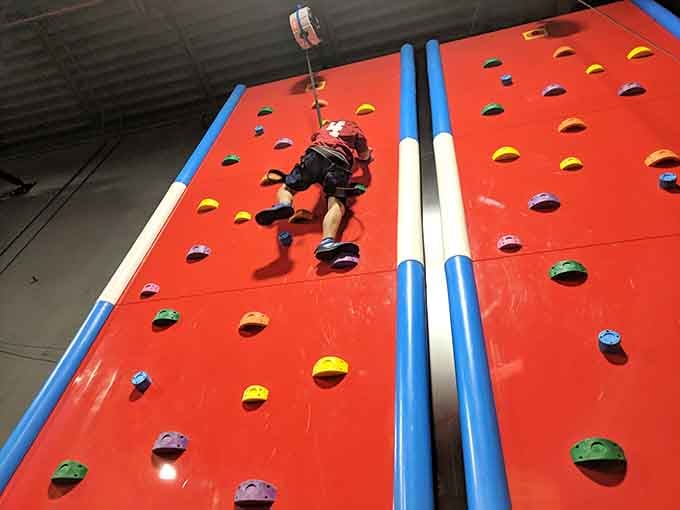 That climbing wall isn't judging your skills, but your kids definitely are watching with great interest.