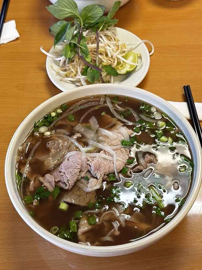 Pho loaded with tender beef and fresh herbs. This bowl could cure what ails you, literally or figuratively.