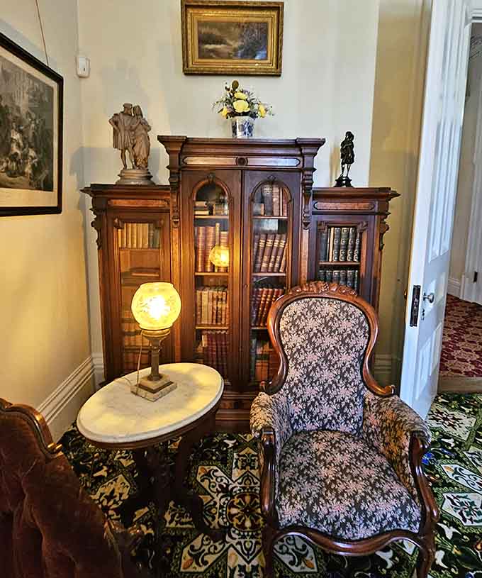 Floor-to-ceiling bookcases filled with leather-bound volumes create a reading nook that puts your Kindle collection to shame entirely.