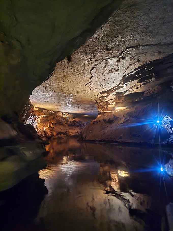 The underground river reflects cave formations like nature's own mirror, doubling the visual spectacle effortlessly.