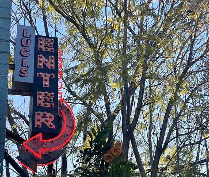 That vintage-style neon sign pointing the way is basically saying "follow me to happiness and good coffee."