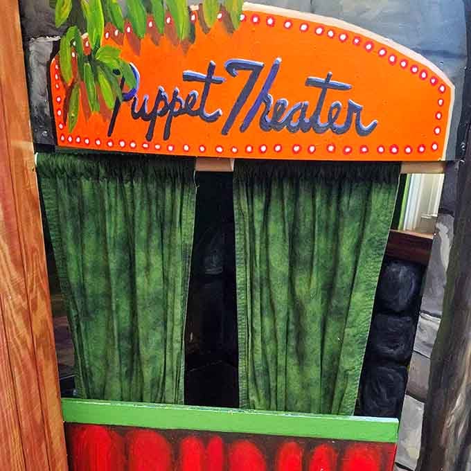 That vintage puppet theater marquee glows with promise, inviting young performers to create their own Broadway moments.