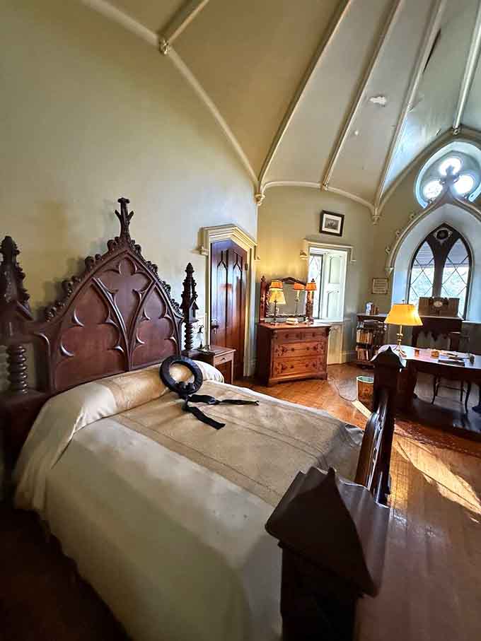 Another bedroom where the furniture costs more than a car and the ceiling makes you forget you're not in a cathedral.
