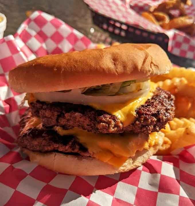 That double cheeseburger stacks up like a delicious architectural achievement, defying gravity and diet plans simultaneously with style.